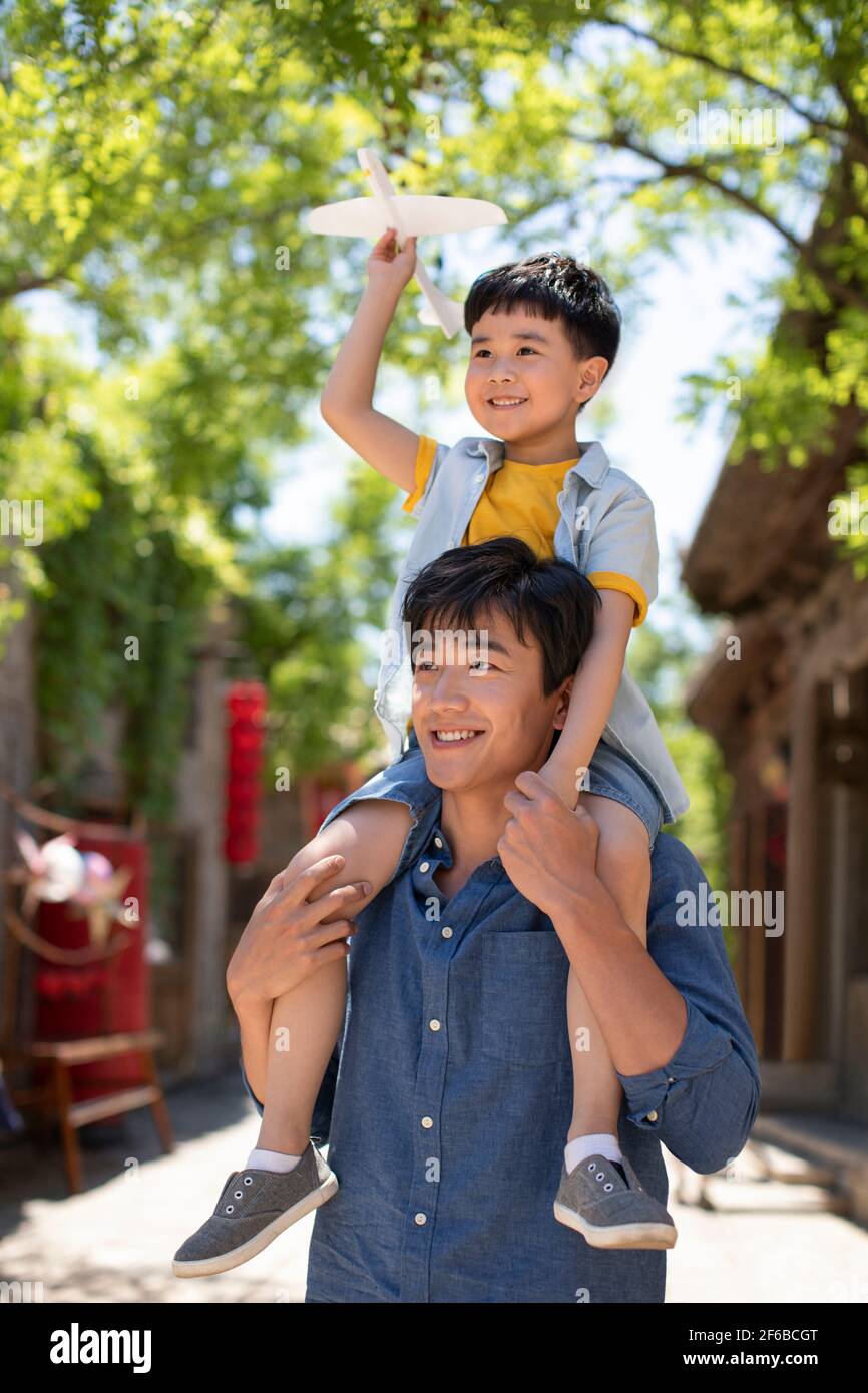 Happy Chinese father and son enjoying vacation Stock Photo - Alamy