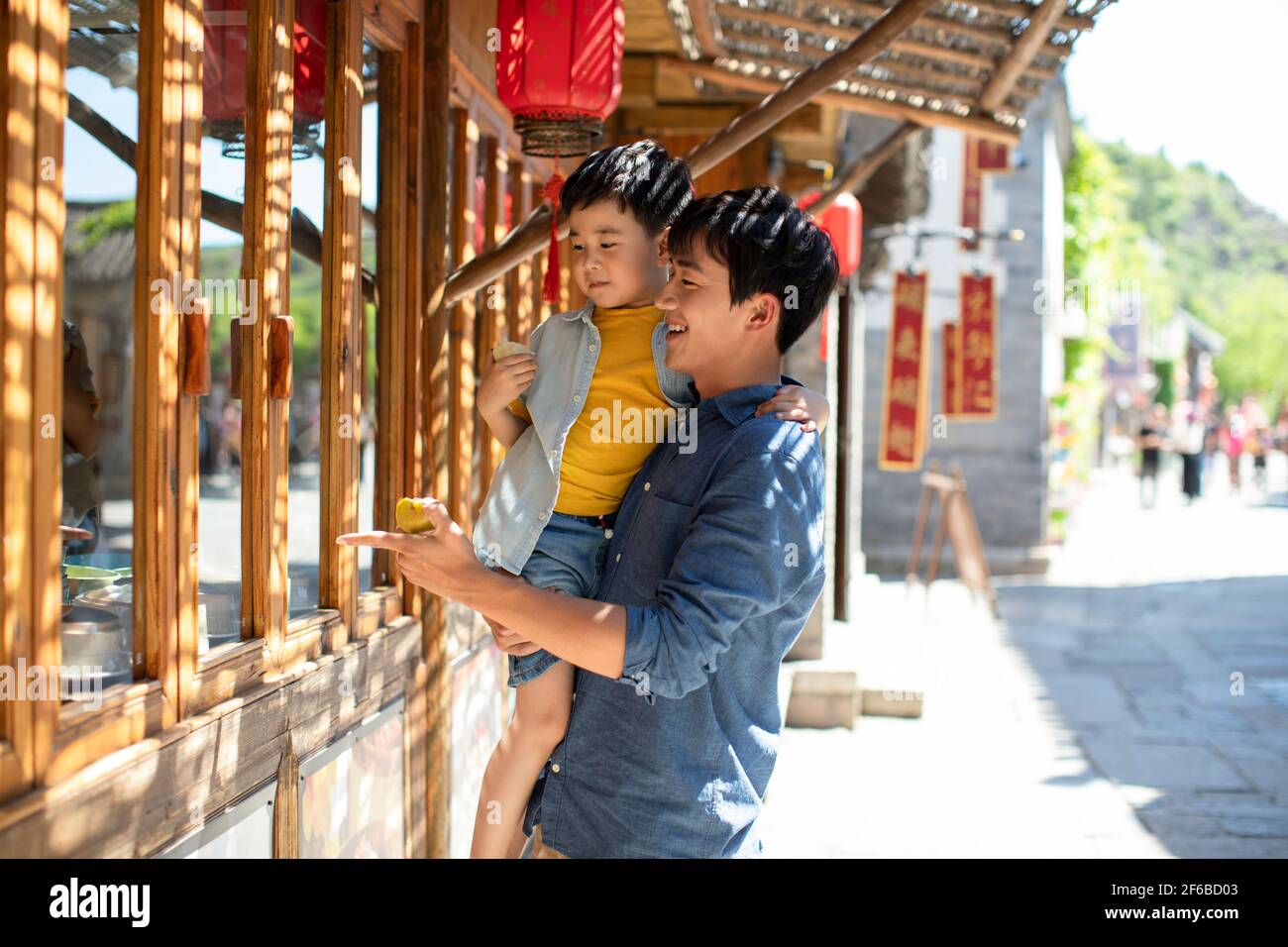 Happy Chinese father and son enjoying vacation Stock Photo - Alamy