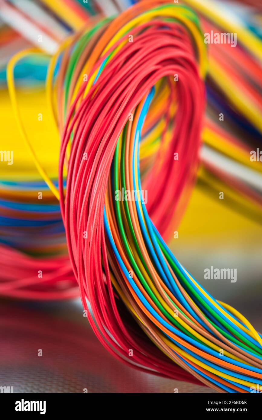 Colorful electrical and telecommunication cable wire on shiny metal ...