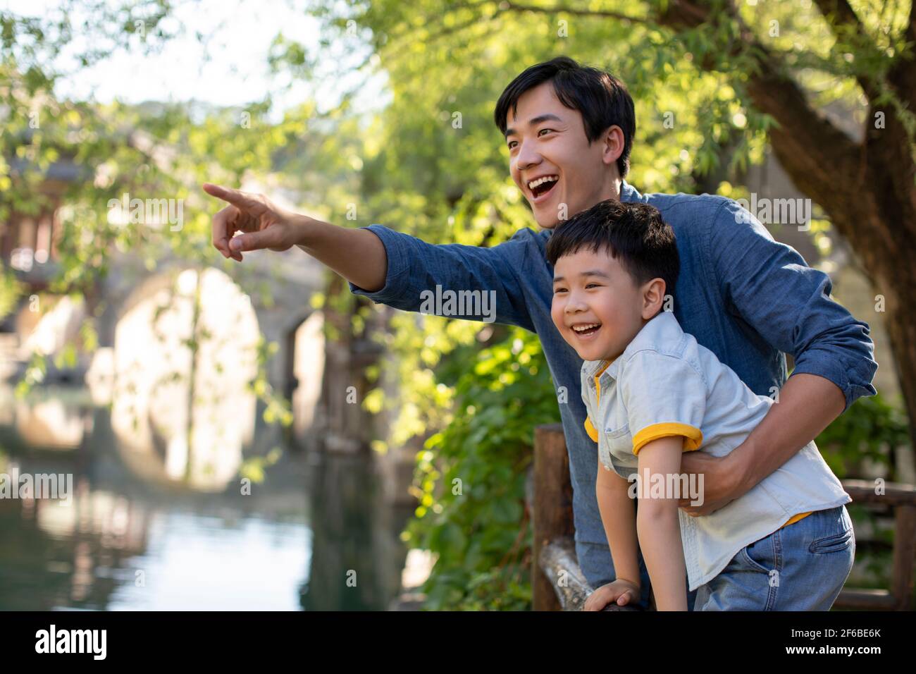 Happy Chinese father and son enjoying vacation Stock Photo - Alamy