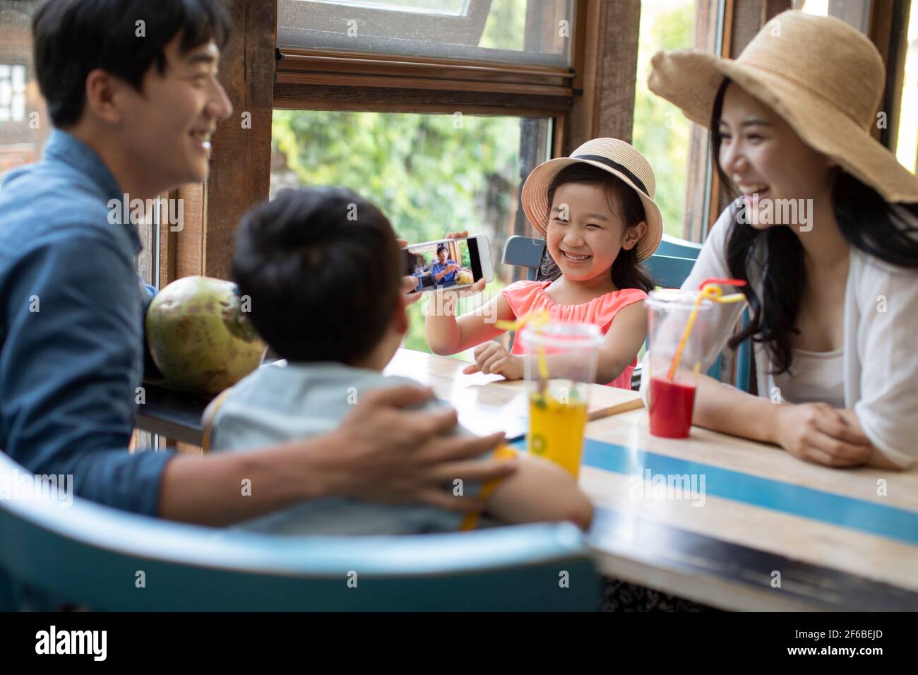 Young Chinese family in restaurant Stock Photo - Alamy