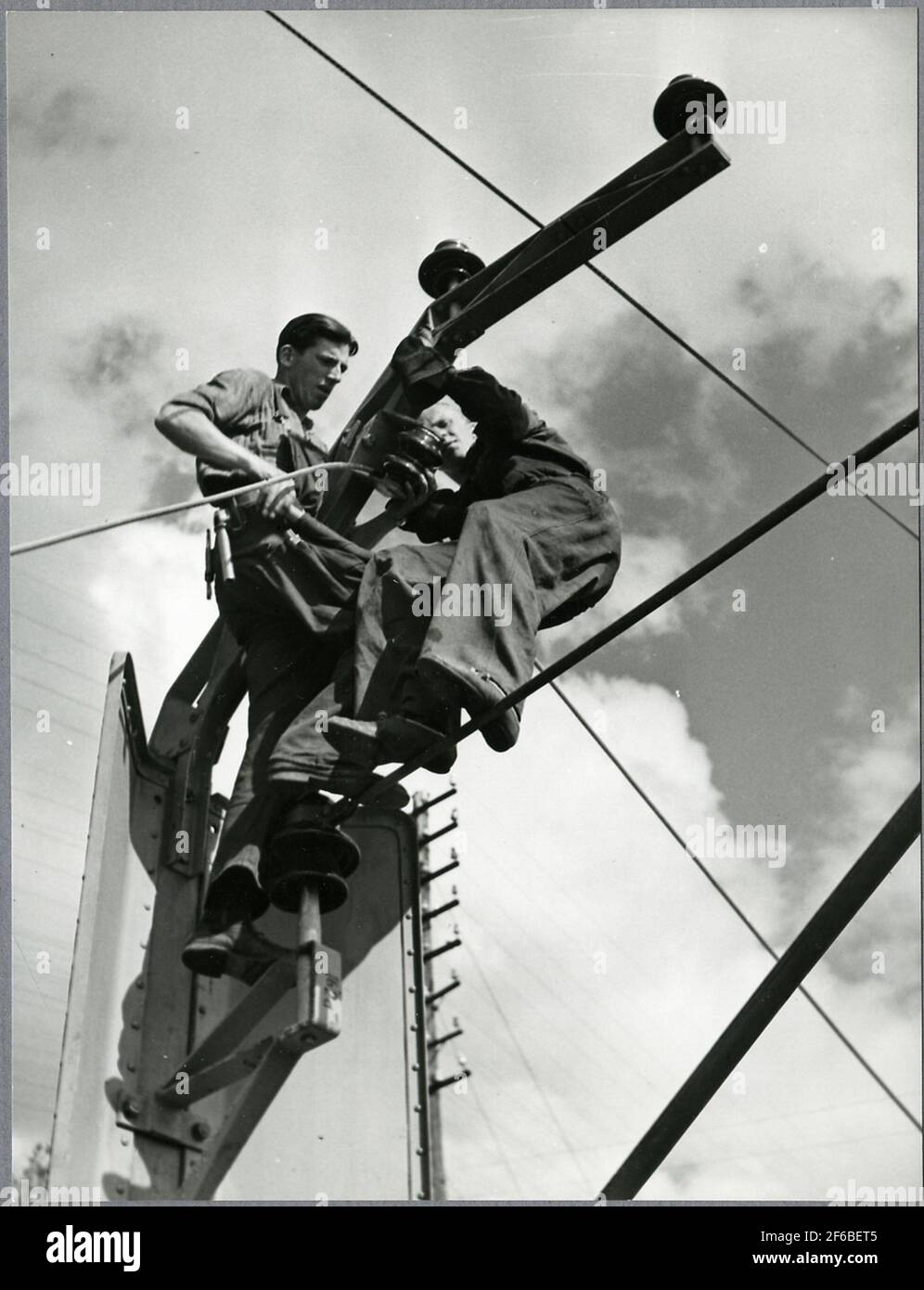 Mounting the contact line. Attachment of return line Stock Photo - Alamy