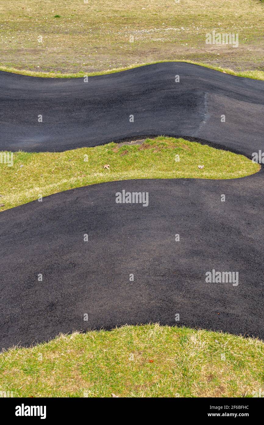 Bicycle pump track grass and asphalt abstract background Stock Photo ...