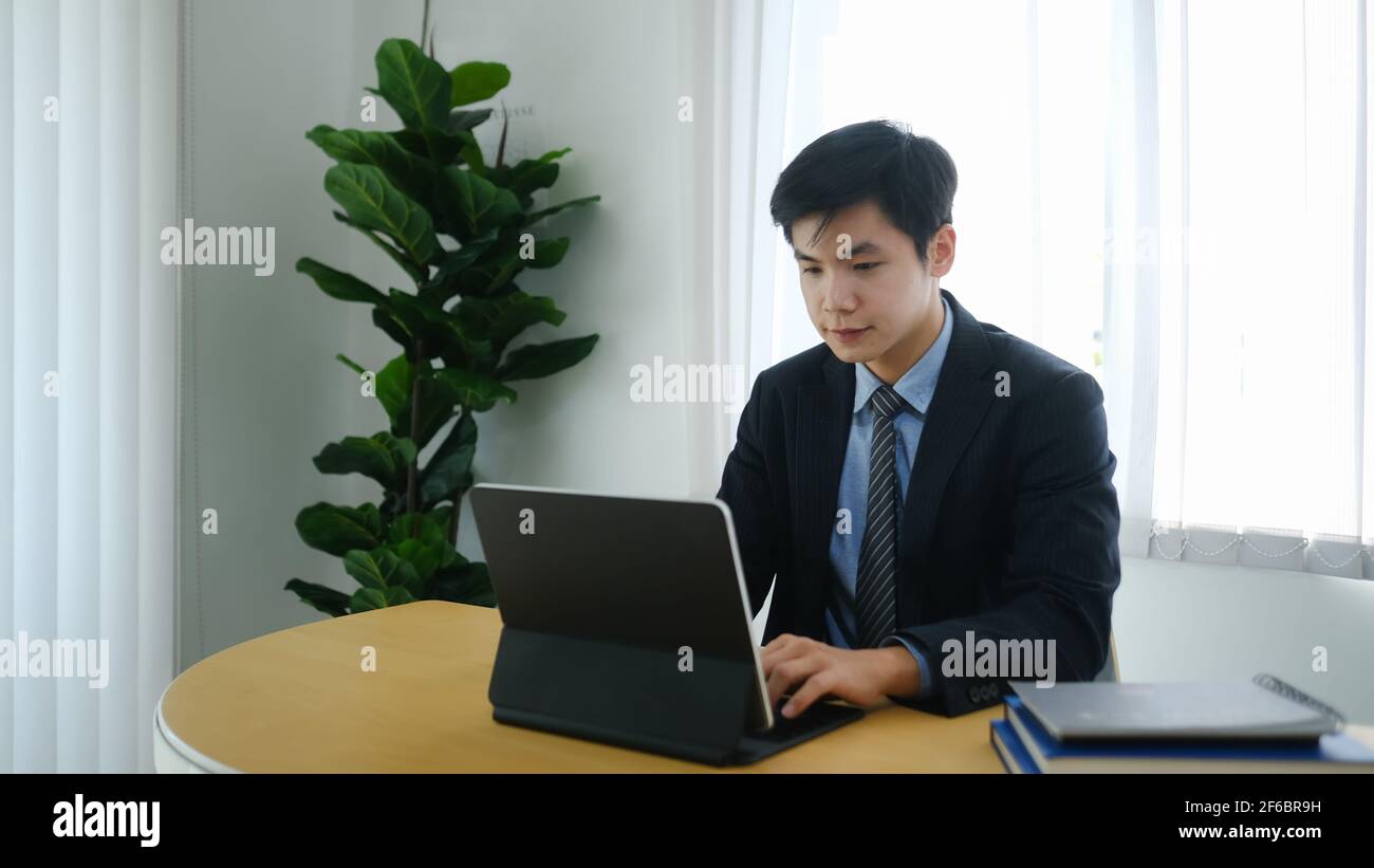 Smart businessman concentrate working on laptop computer at office ...