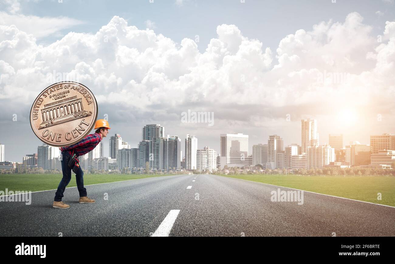 Builder man carry coin Stock Photo - Alamy