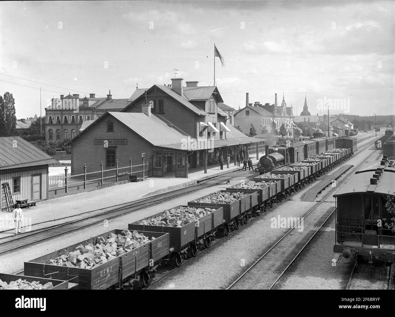 Person train and ore trains at the station Stock Photo - Alamy