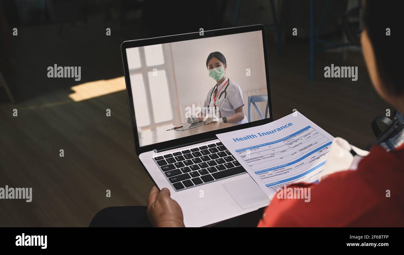 Close up view of mature woman patients using laptop computer having ...