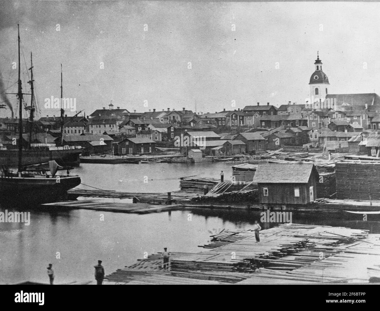 Ships Intore Woodload in Northern Harbor Stock Photo - Alamy