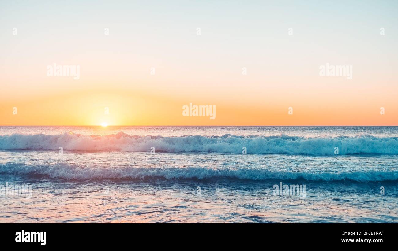Waves crashing at sunset, Moana Beach, South Australia Stock Photo - Alamy