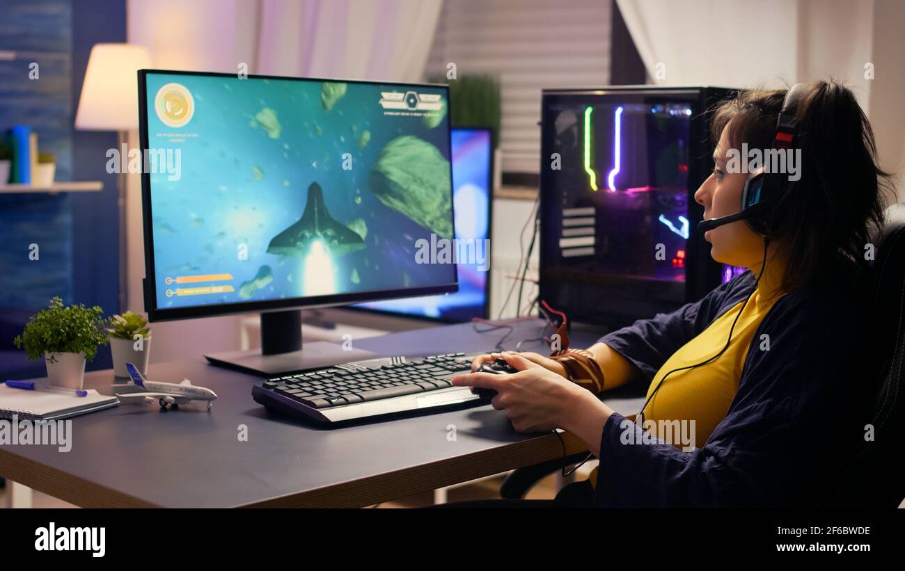 Pro player talking into microphone with other players for space shooter ...