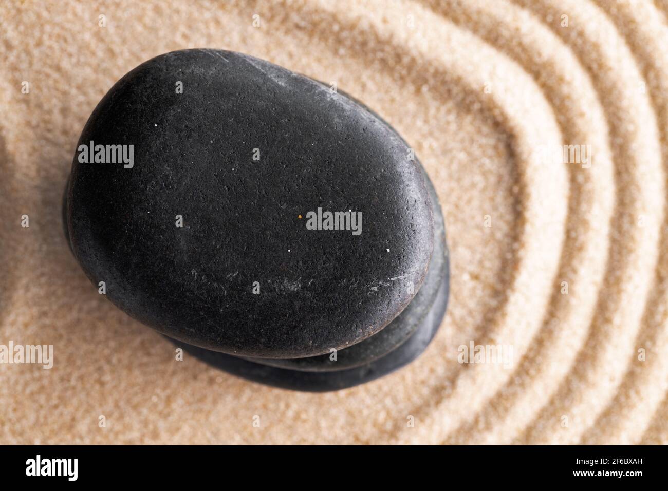 Japanese zen garden with stone in raked sand Stock Photo - Alamy