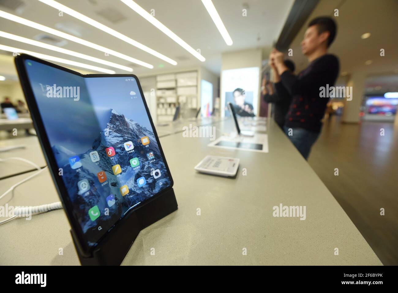 HANGZHOU, CHINA - MARCH 31, 2021 - A customer experiences Mi Mix Fold ...