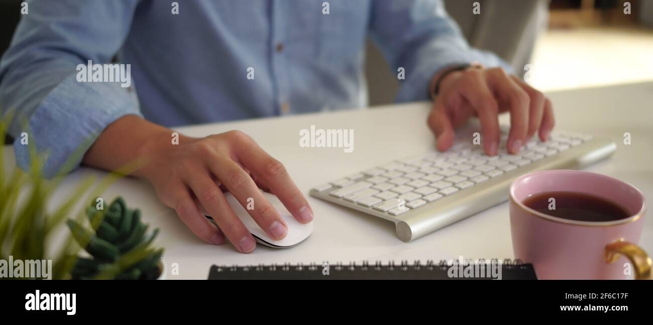 Horizontal image of man graphic designer hand typing on wireless ...