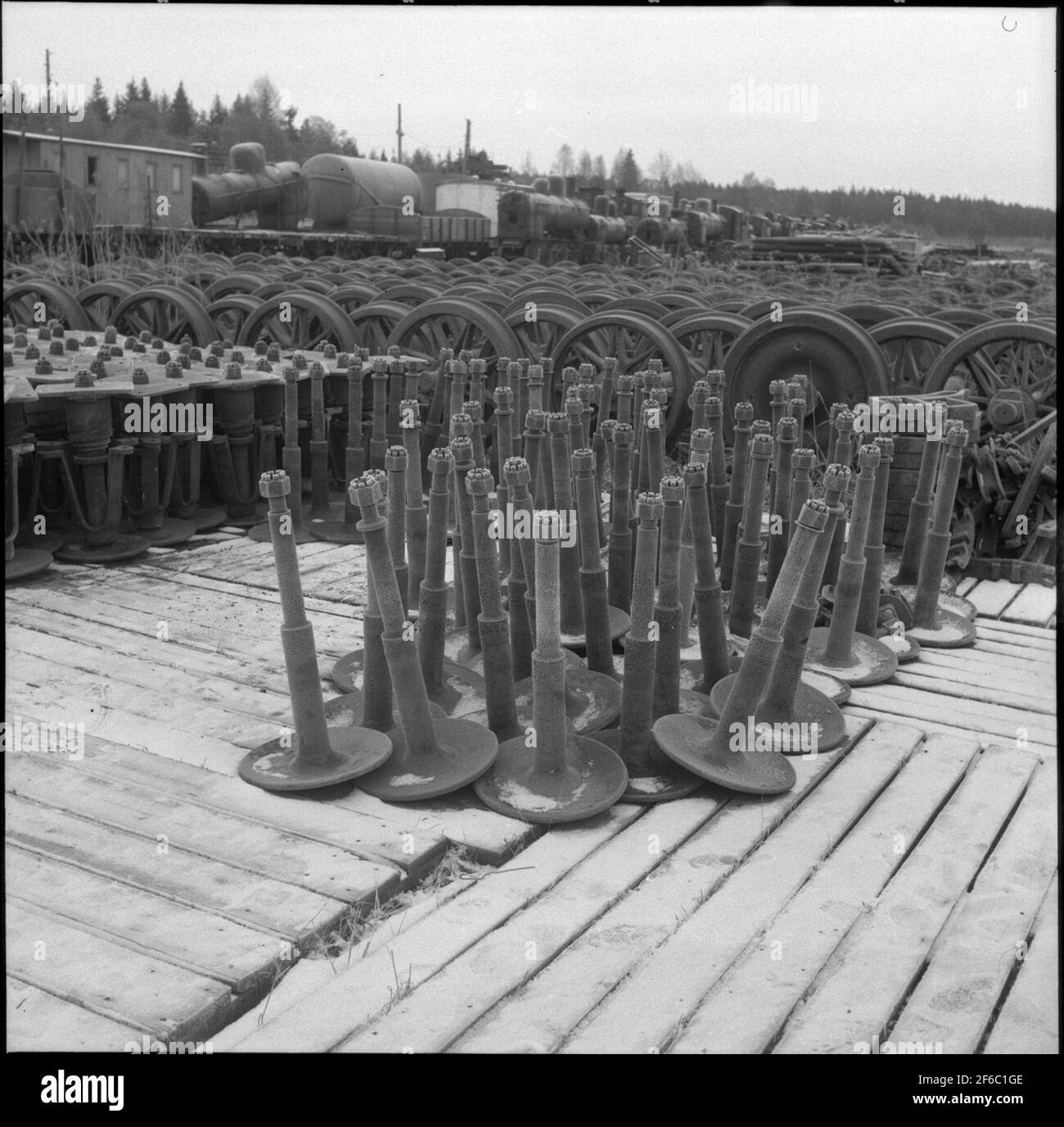 Steam locomotive, carriage wheel and 98 buffers etc. at Vislanda scrap ...