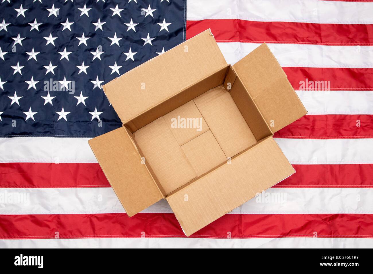 USA flag and shipping box. Delivery from the USA Stock Photo - Alamy