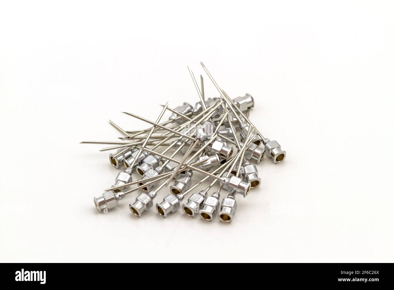 Stack of reuse iron needle No.18 G for drug needle on white background ...
