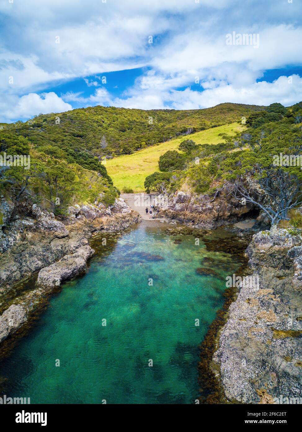 Turquoise color of shallow water in bay between rocks. Aerial view of ...