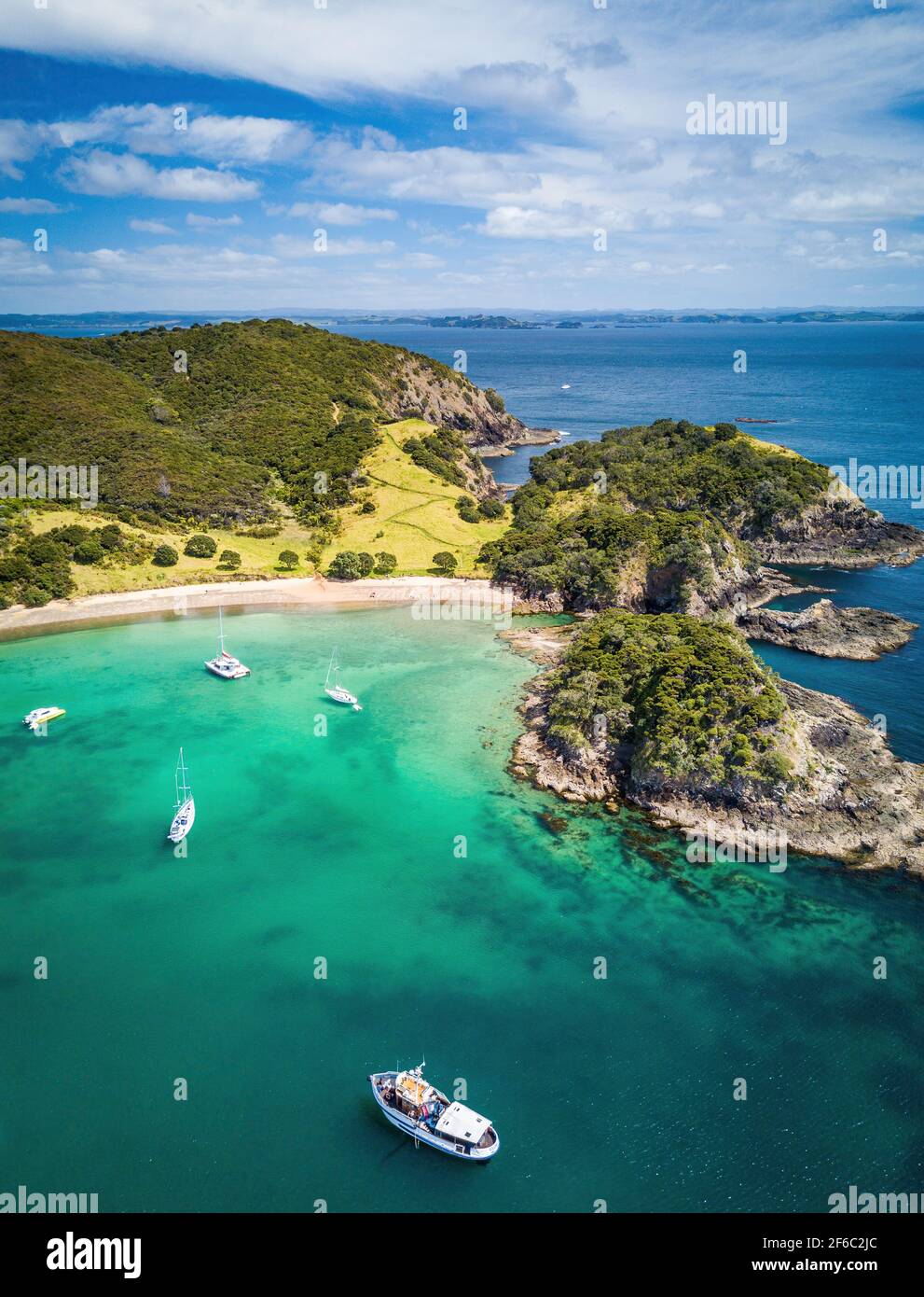Turquoise color of shallow water in sea bay. Aerial view of New Zealand ...