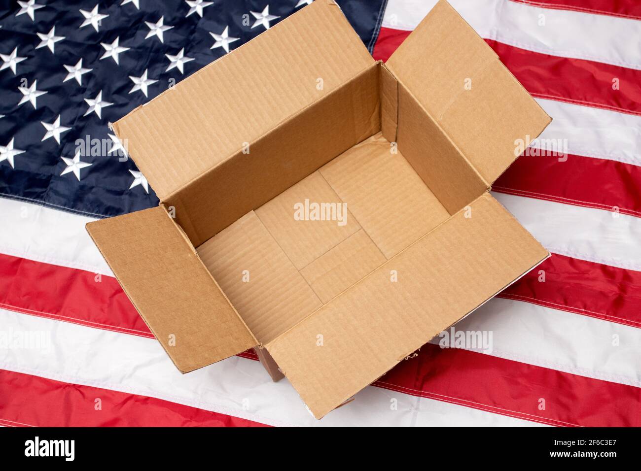USA flag and open shipping box. Delivery from the USA Stock Photo - Alamy