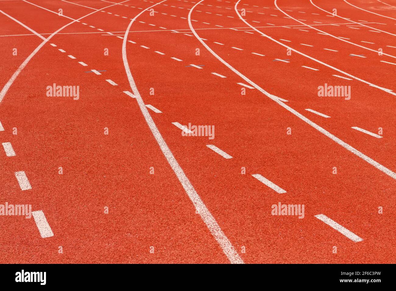 white dash line on red running track Stock Photo - Alamy
