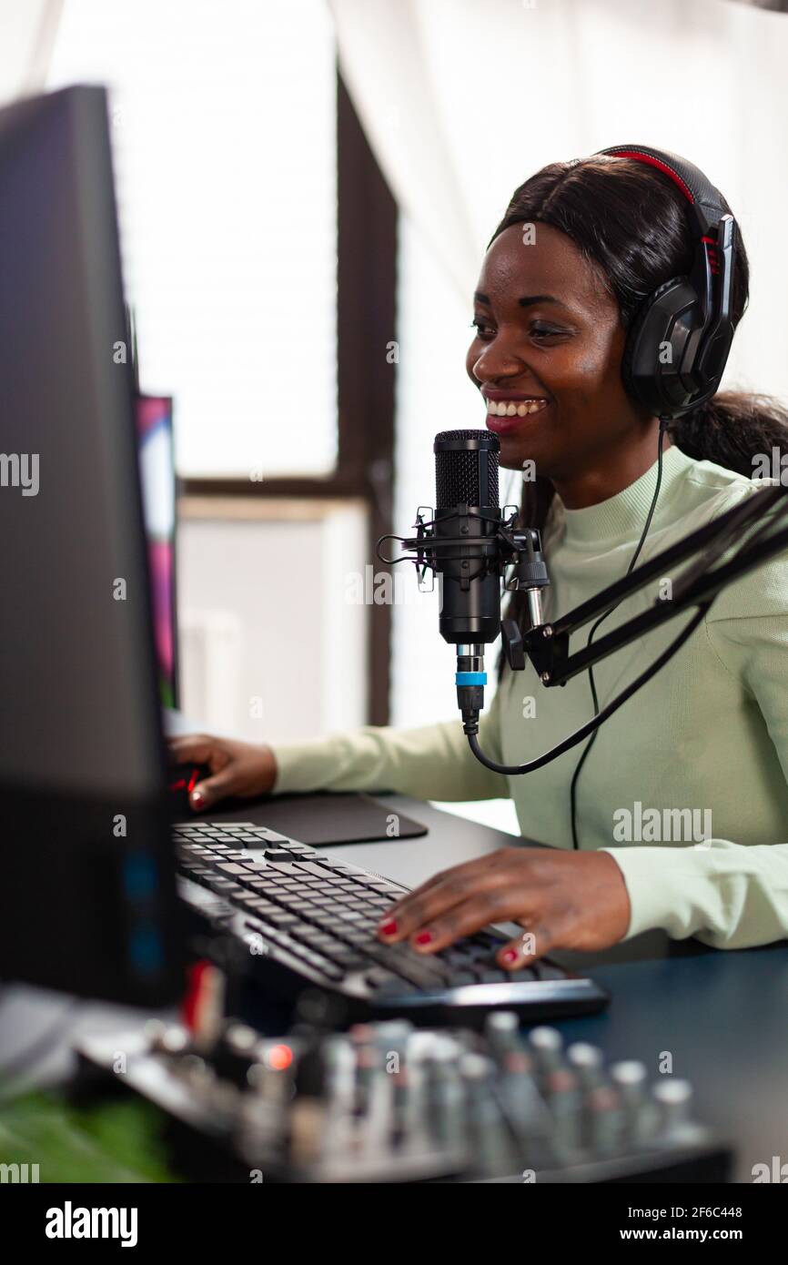 Professional esport streamer talking with teammates during live ...