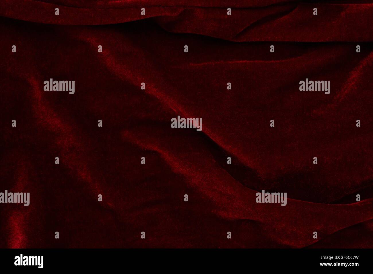 Dark red velvet fabric background Stock Photo - Alamy