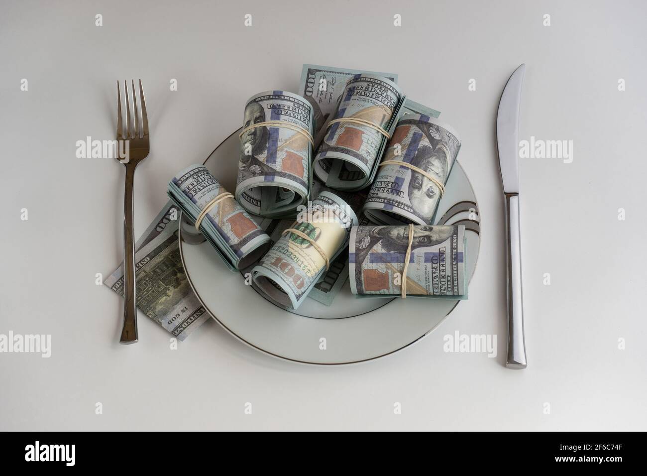 Cash in plate hundred dollar bills on white background, Money meal ...