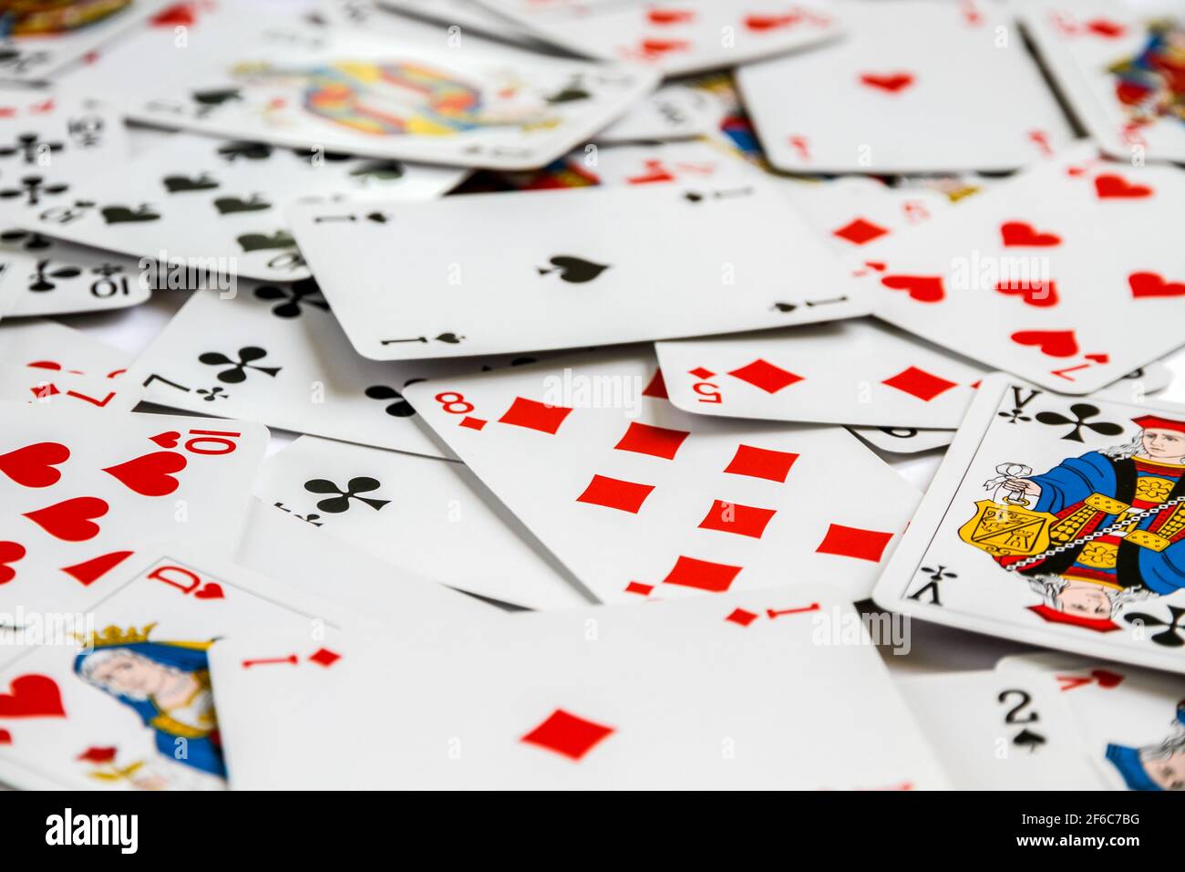 Classic playing card game laid out on a table. White background Stock ...