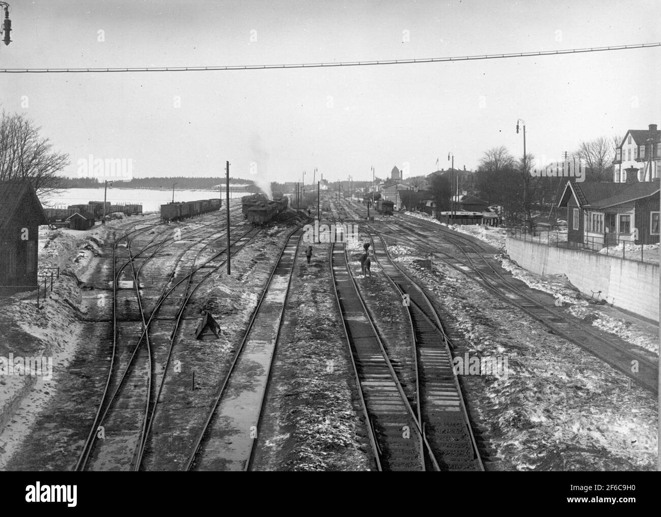 The railroad stands four pesons and works Stock Photo - Alamy