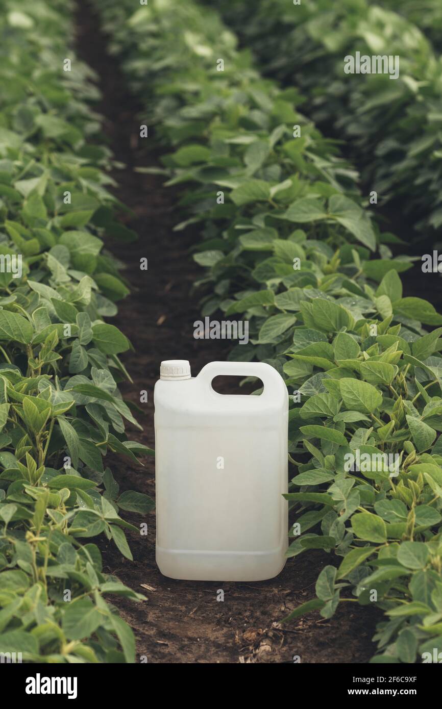Soybean crop protection concept with blank generic pesticide canister ...