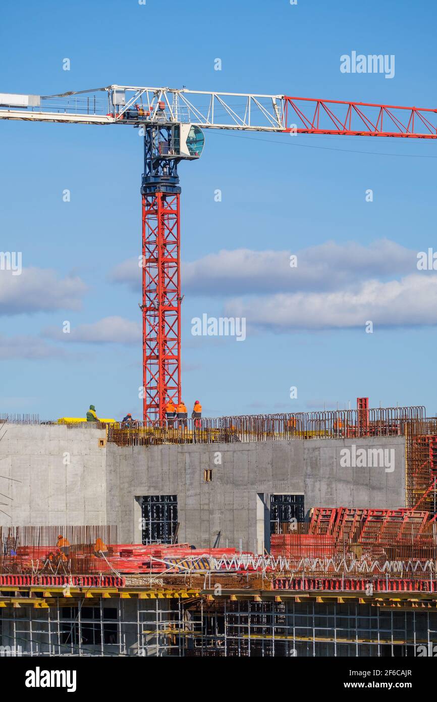 Modern crane on construction site Stock Photo - Alamy