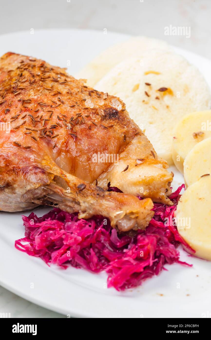 roasted goose leg with red cabbage and dumplings Stock Photo - Alamy