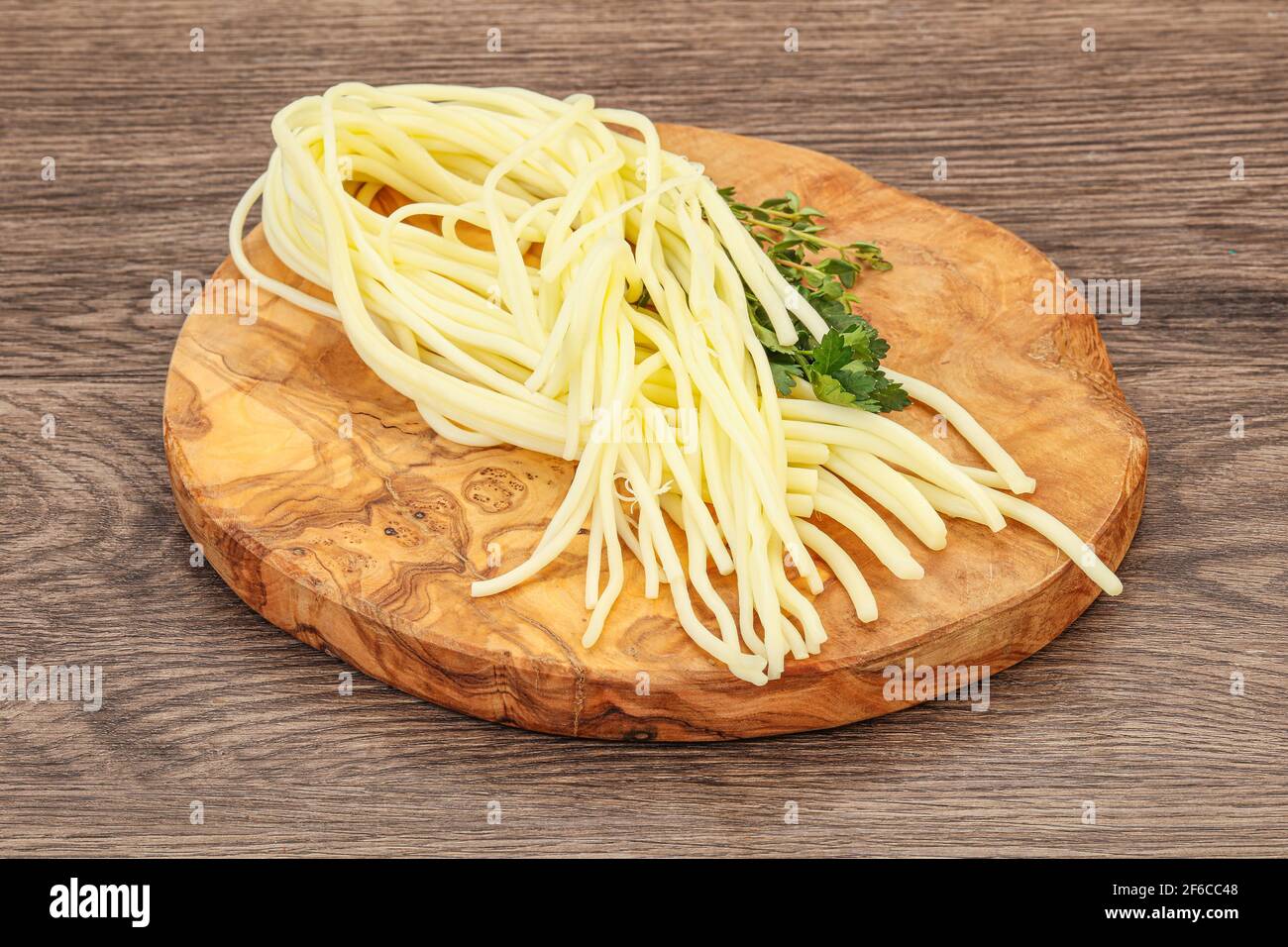 Chechil spaghetti cheese snack over board Stock Photo - Alamy