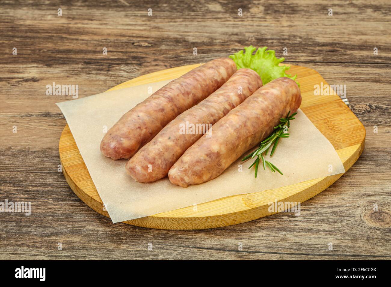 Raw pork meat sausages for grill served rosemary Stock Photo - Alamy
