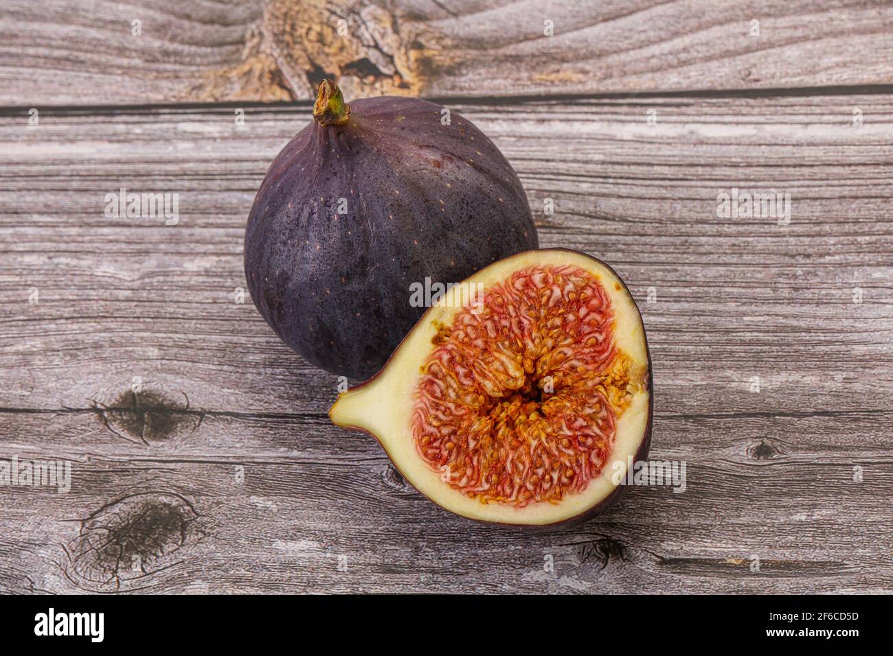 Sweet purple slice of fig fruit Stock Photo - Alamy