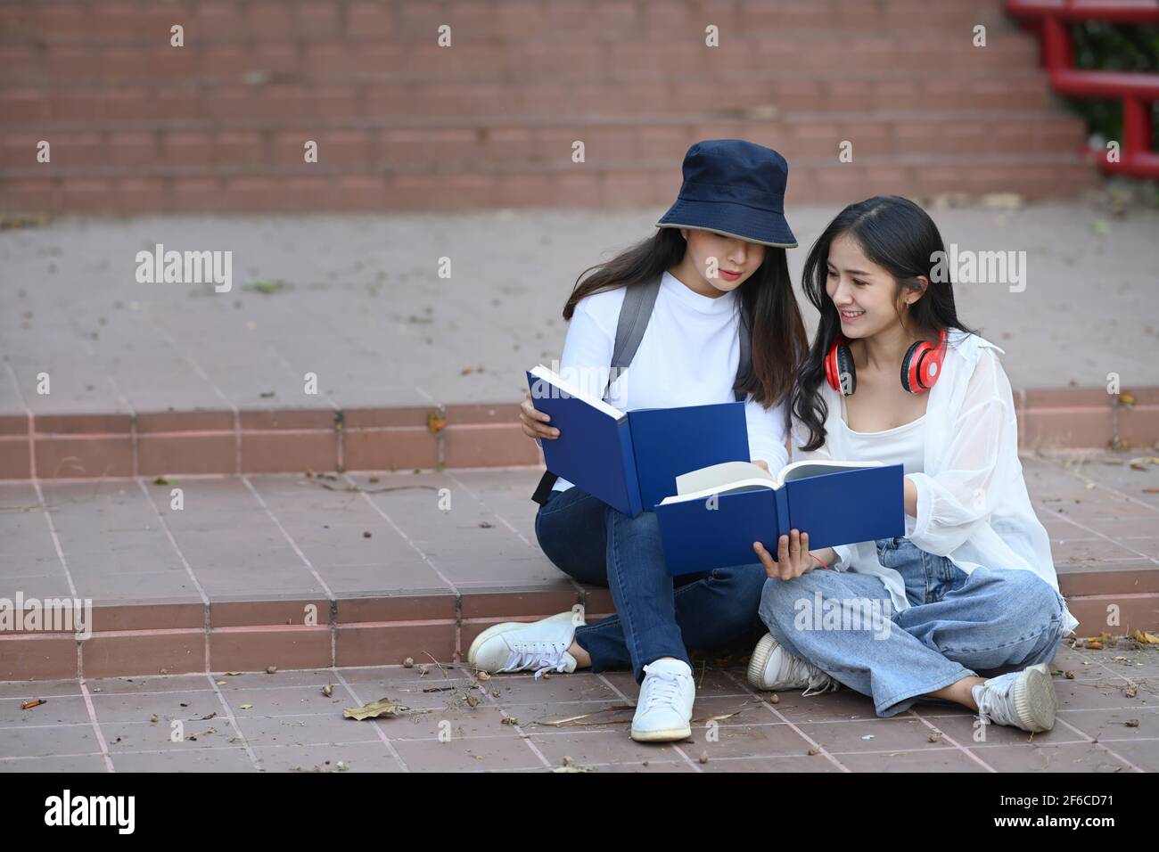 College students reading interesting hi-res stock photography and ...