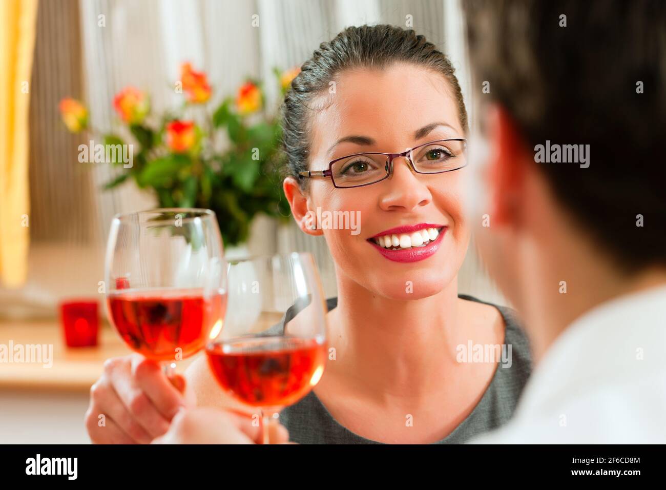 Young couple having romantic dinner - both drinking rose wine Stock ...