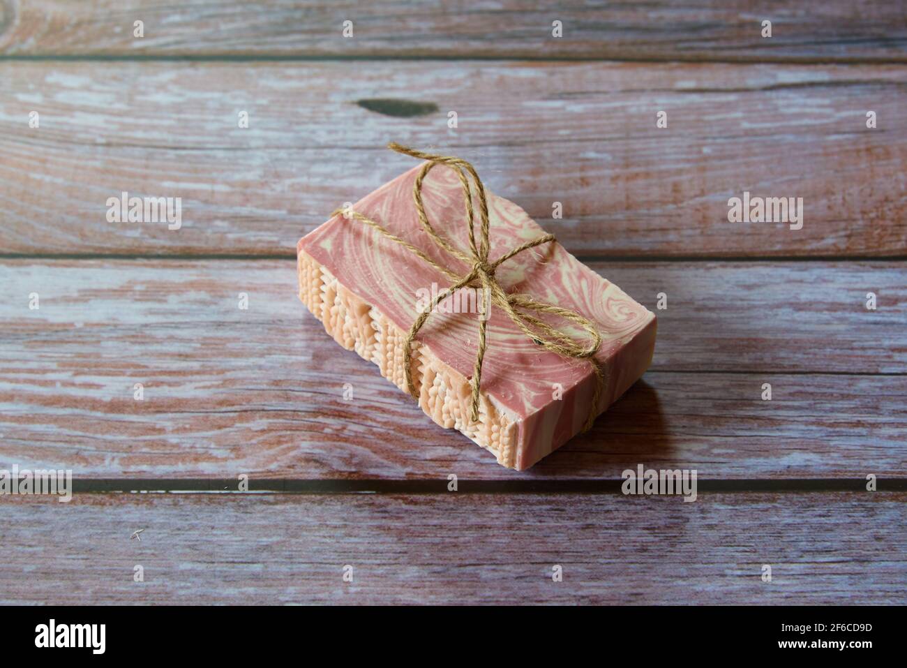 Pink textured handmade soap on a gray background. Personal hygiene ...