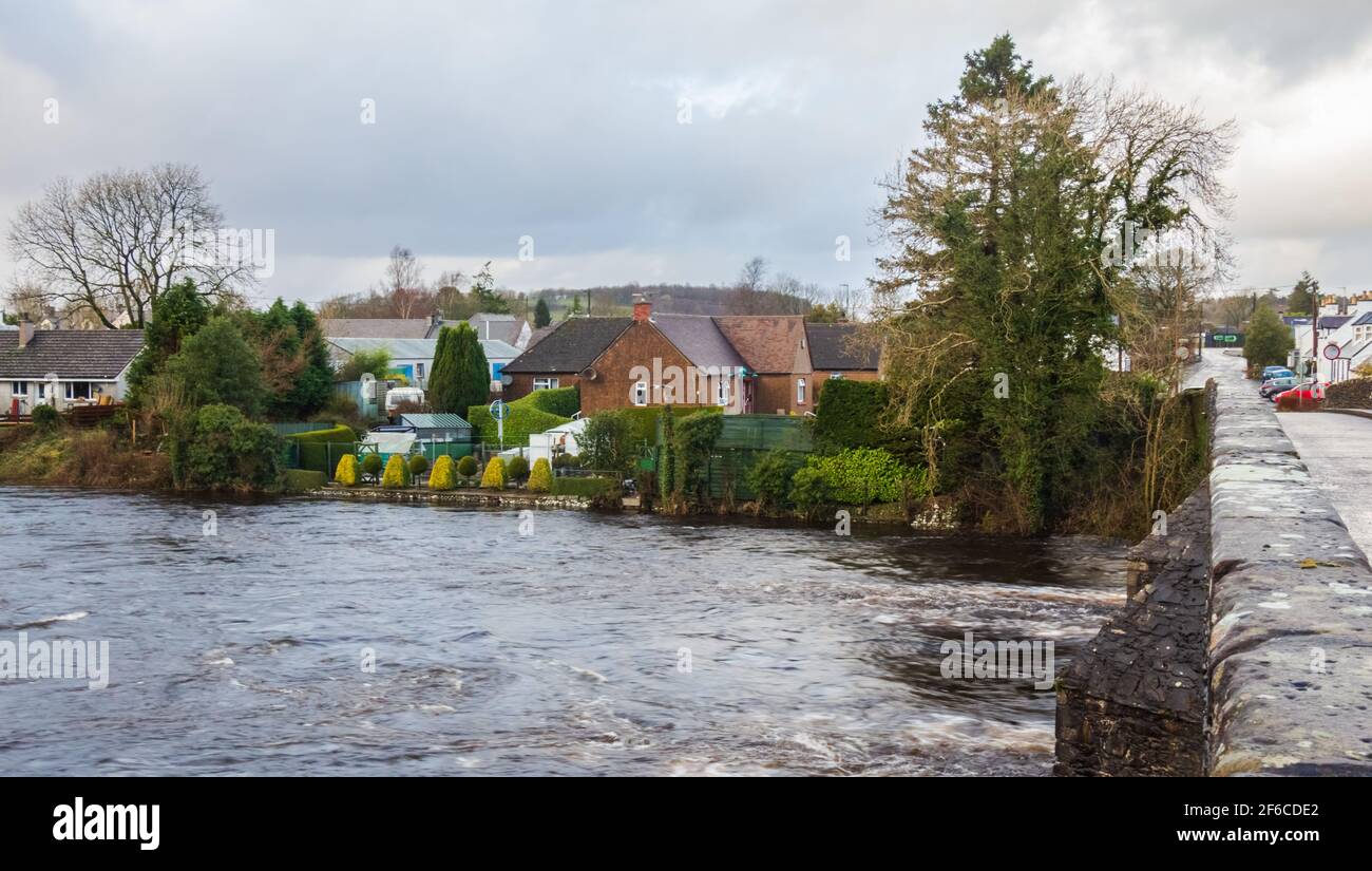 Flood water about to flood houses on the River Dee at the Bridge of Dee ...