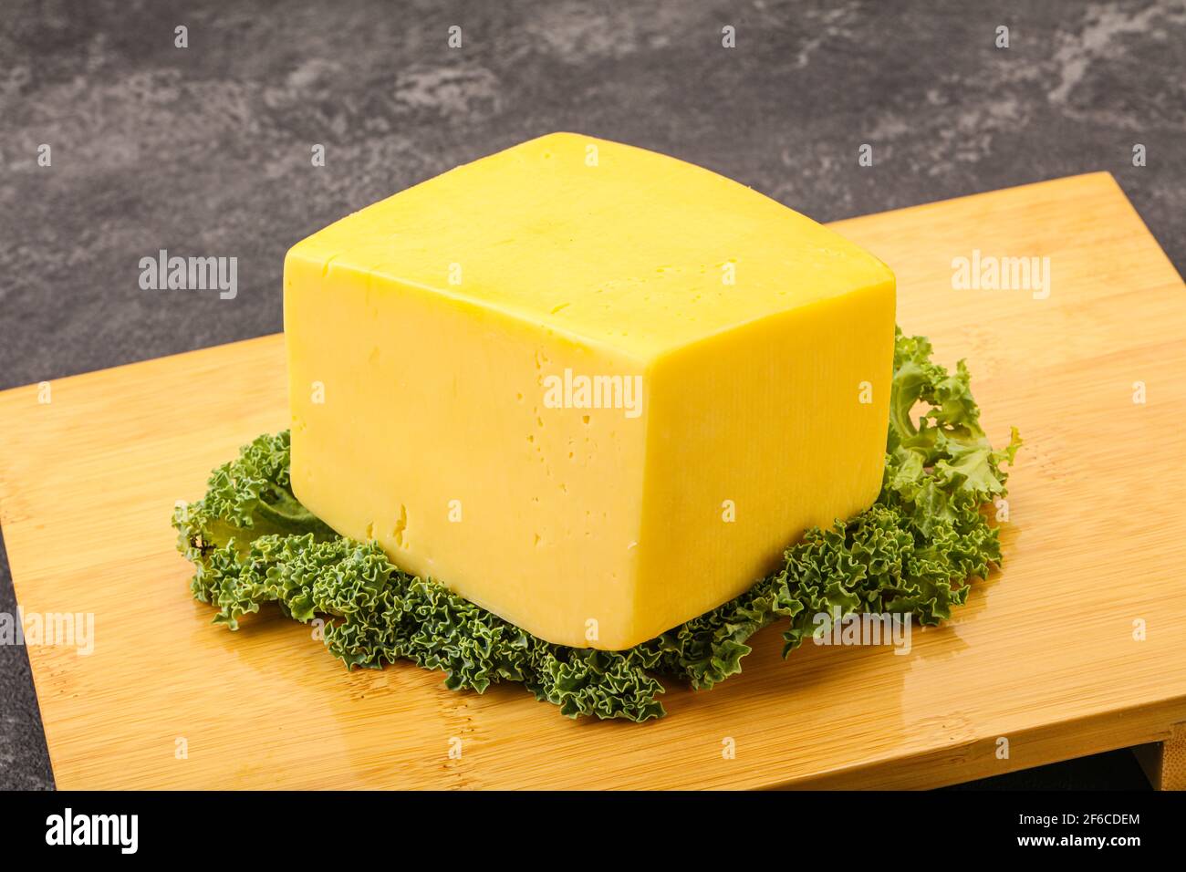 Yellow tilsiter cheese dairy product brick Stock Photo - Alamy