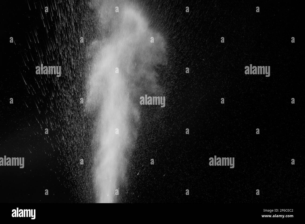 Curly white steam rising up and splashing water scattering in different ...