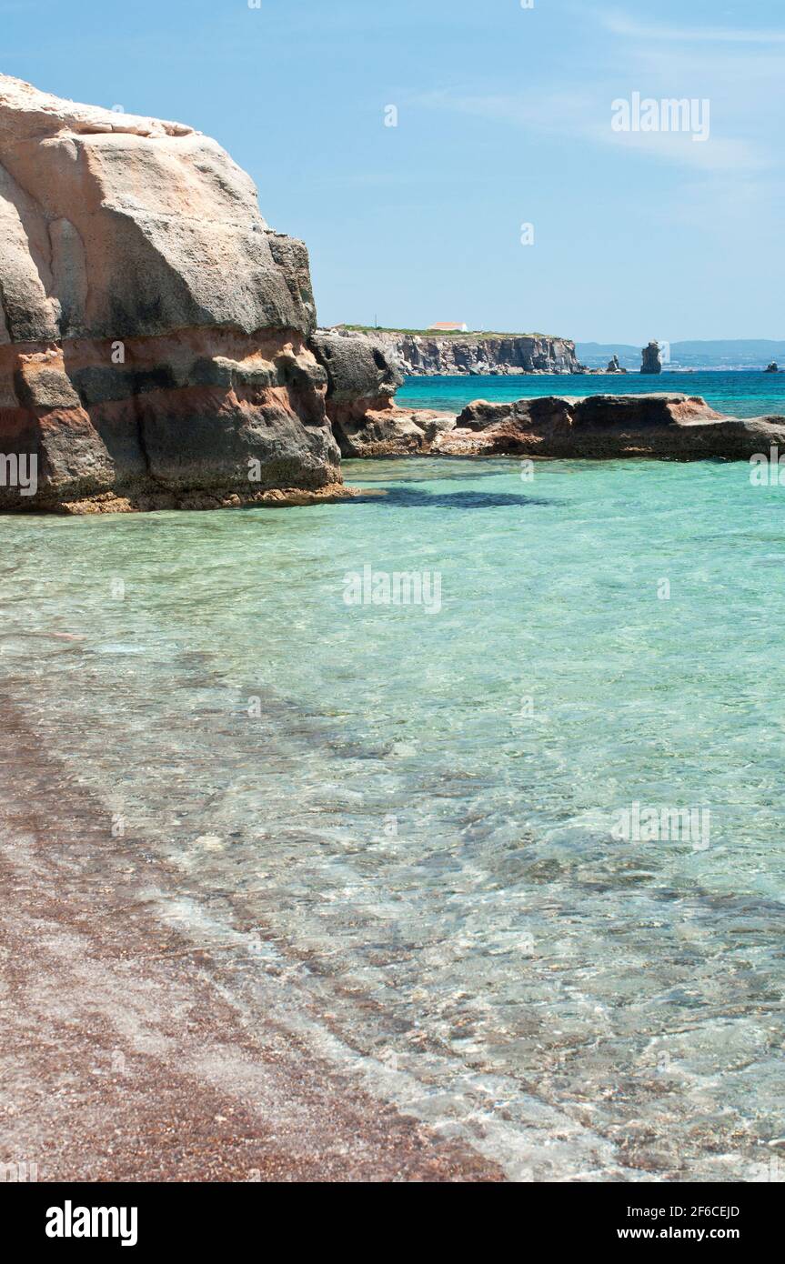 crystal clear water, white sand and colored rocks in Genio beach ...