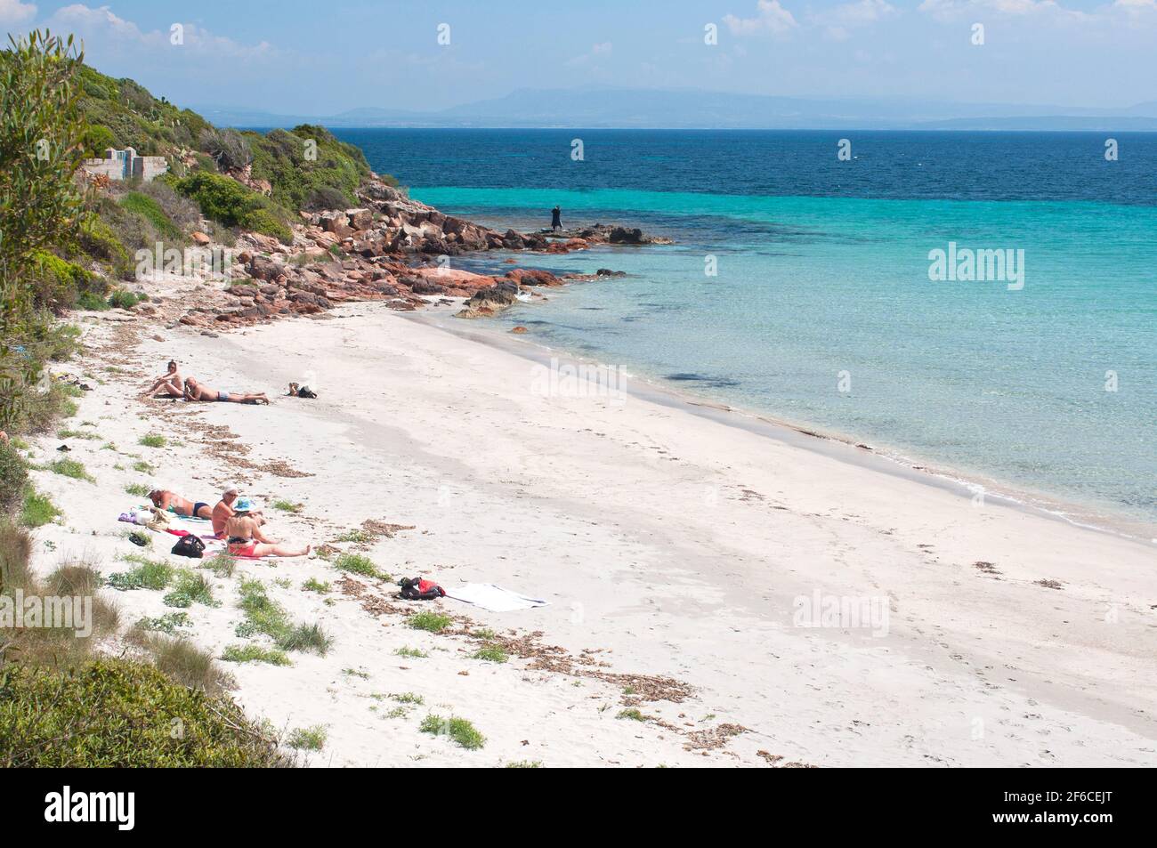 crystal clear water, white sand and colored rocks in Girin beach ...