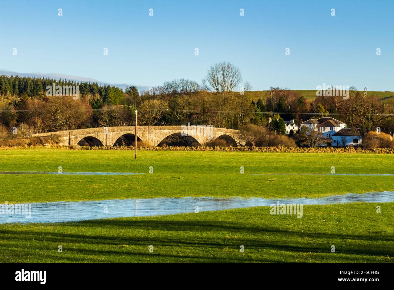 A flooded green field and the Ken Bridge at New Galloway, Dumfries and ...
