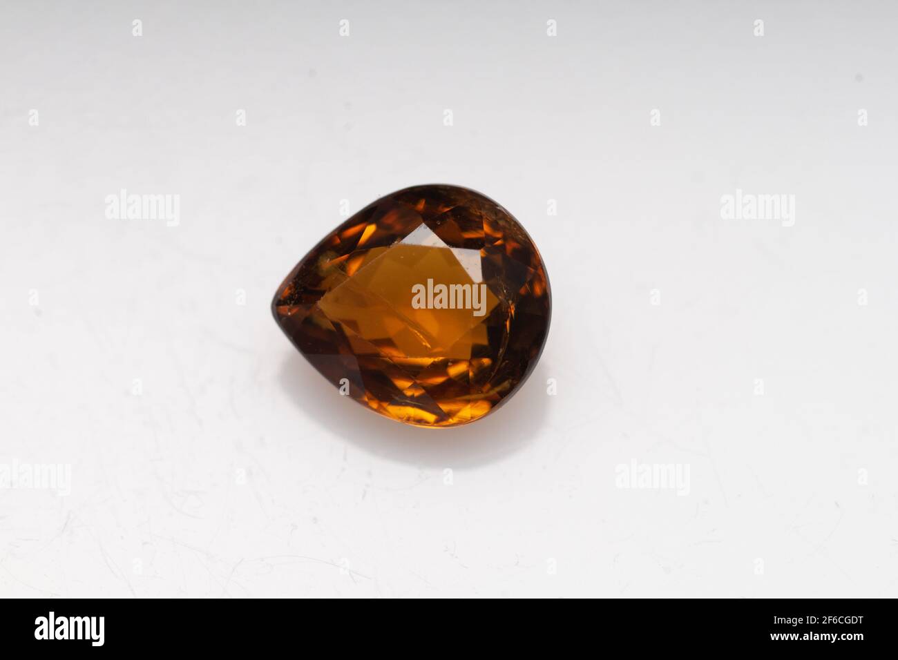 Natural gemstone garnet grossular on white background Stock Photo - Alamy