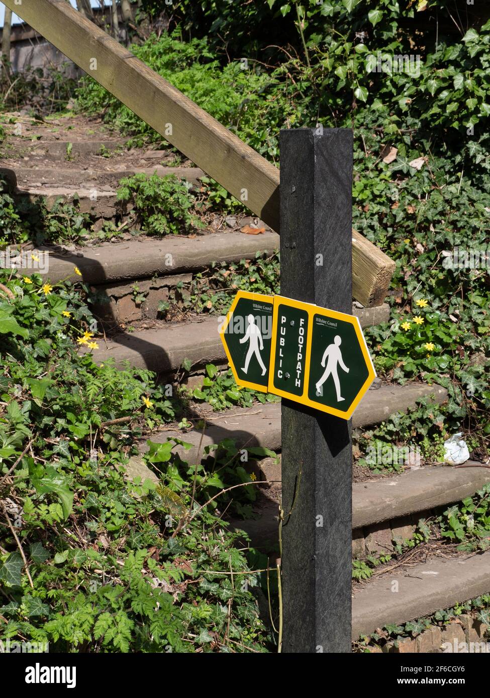 Public footpath sign by steps at Penleigh, Westbury, Wiltshire, England ...