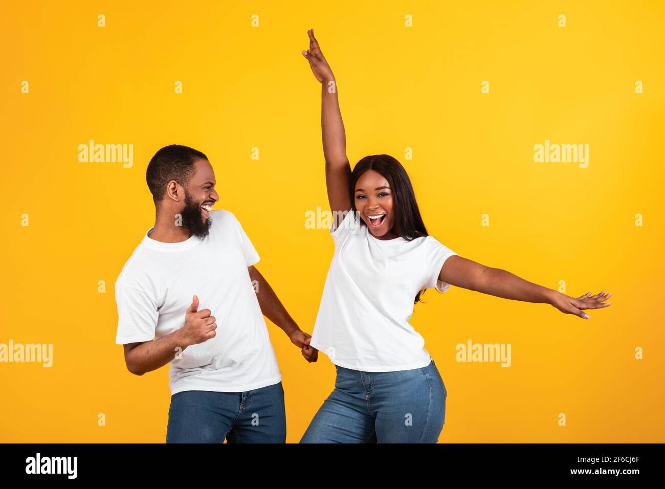 Portrait of emotional black couple dancing at studio Stock Photo - Alamy