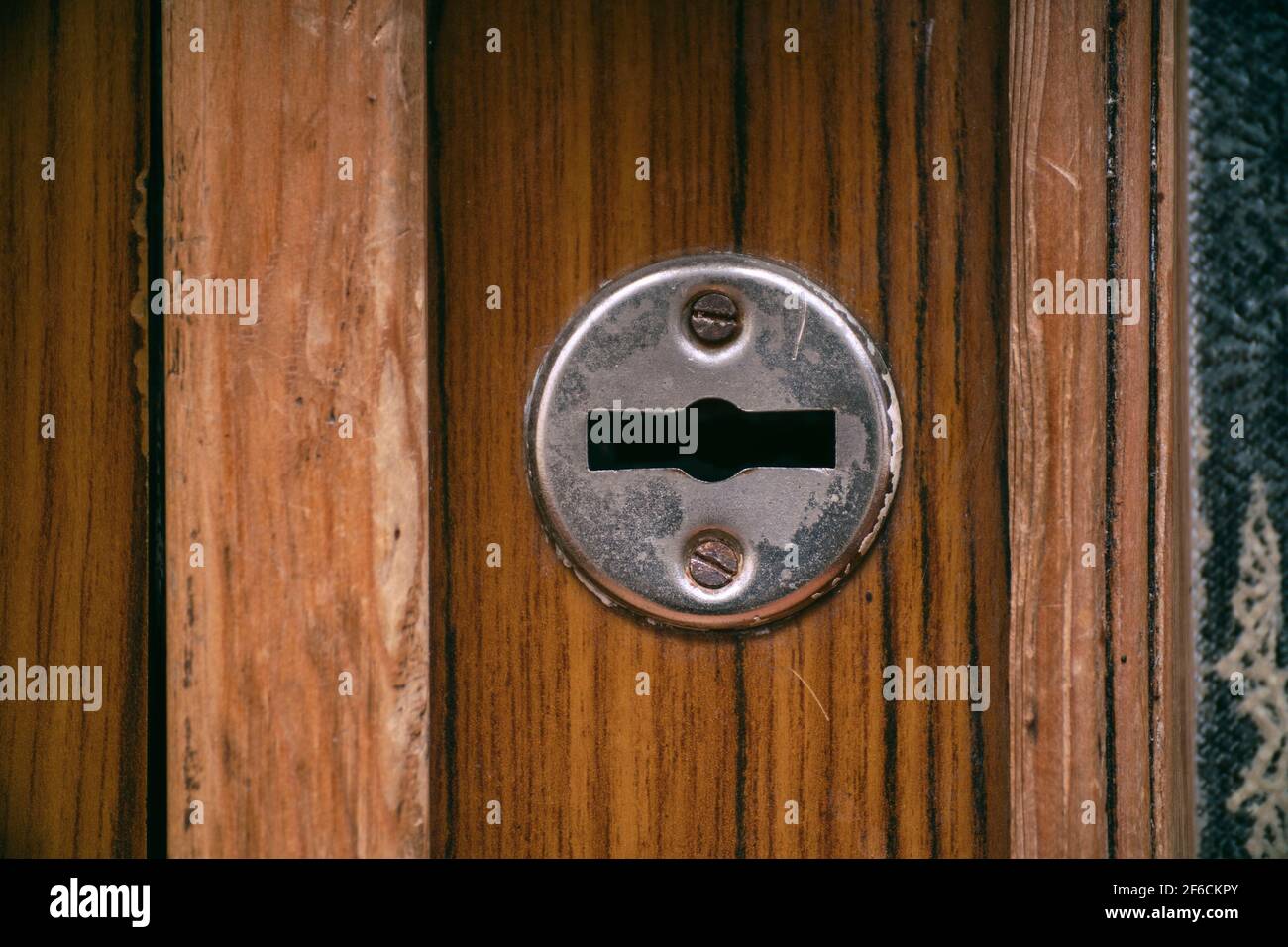 Horizontal iron keyhole on an old wooden door Stock Photo - Alamy