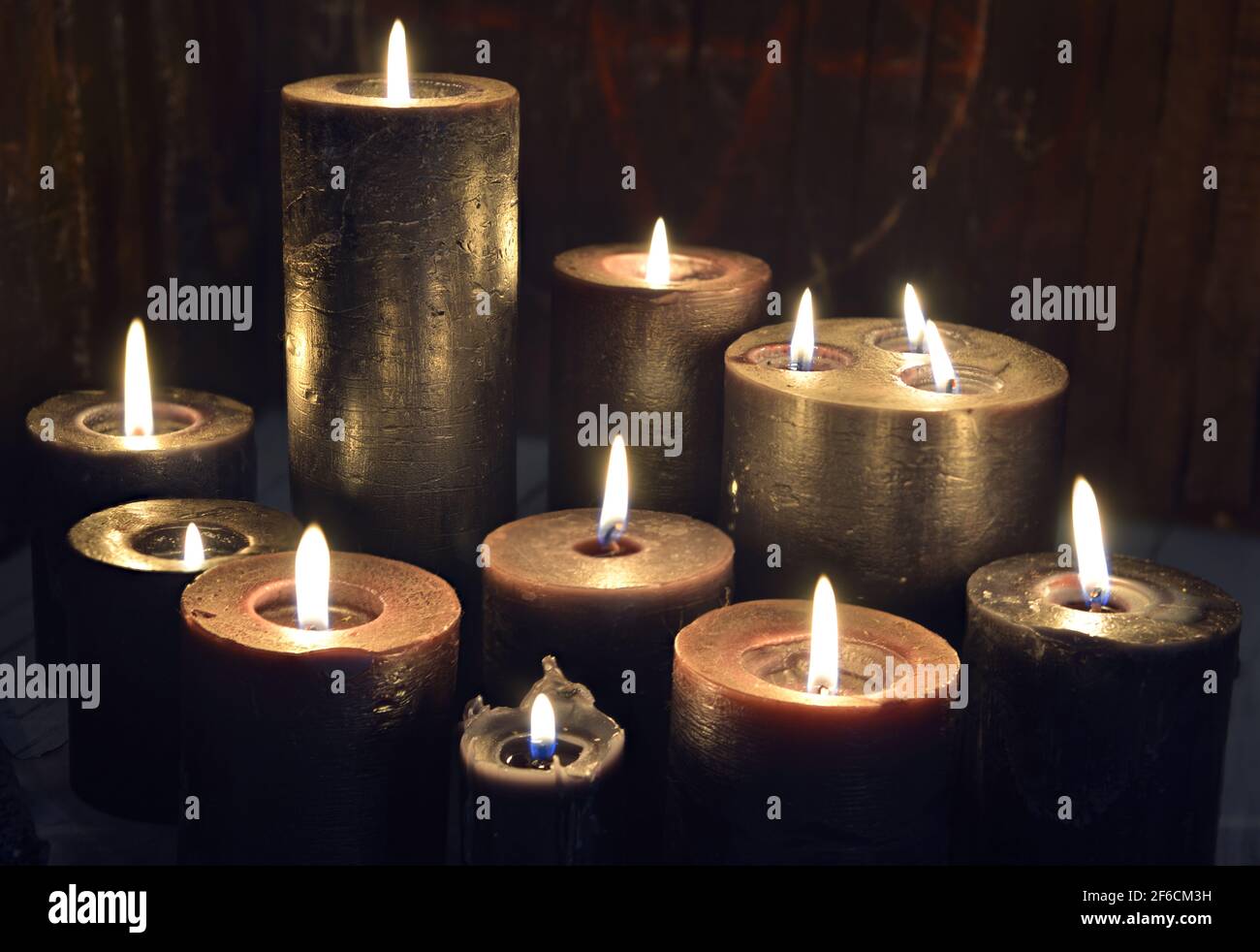 Still life with group of burning candles on witch altar. Esoteric ...