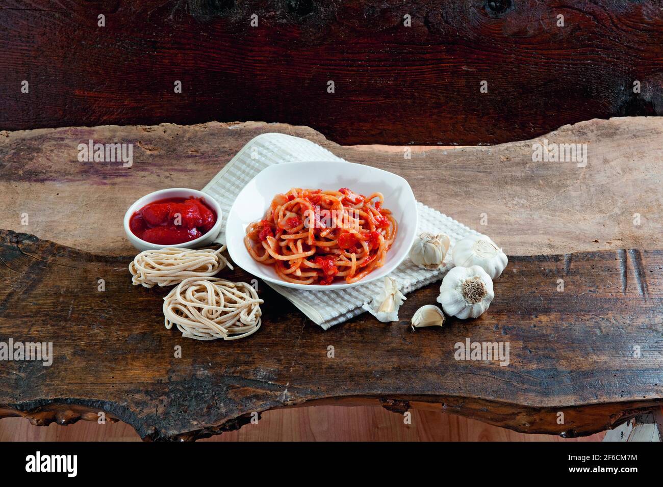 Italian pici with garlic and tomato sauce Stock Photo - Alamy